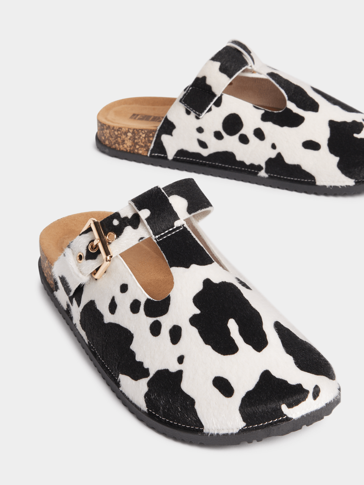 The FIX Women's White Cow Print Mules | Bash